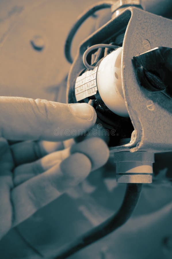 Man Connecting Cables Wiring a Switch on an Industrial Machine Stock ...