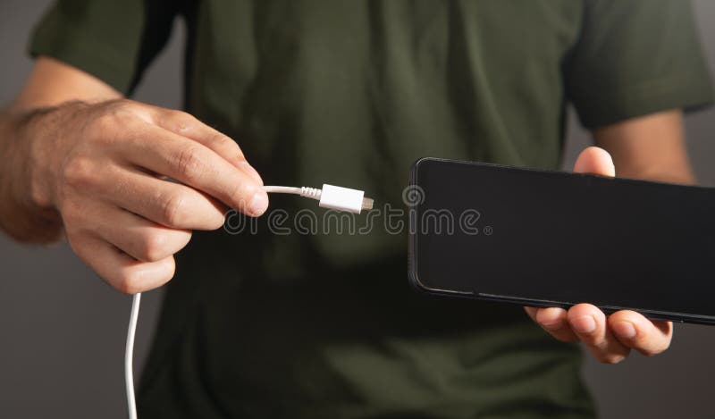 Man Connecting Charger Cable To Mobile Phone Stock Image - Image of ...