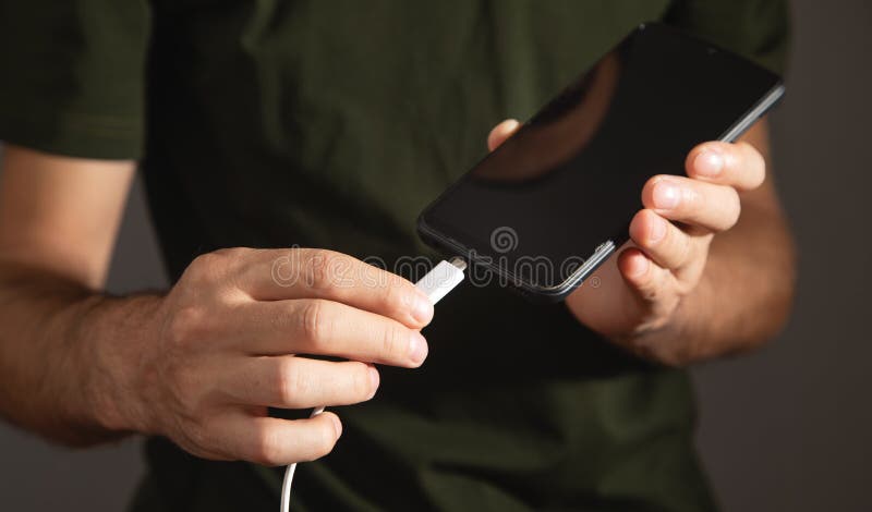 Man Connecting Charger Cable To Mobile Phone Stock Image - Image of ...