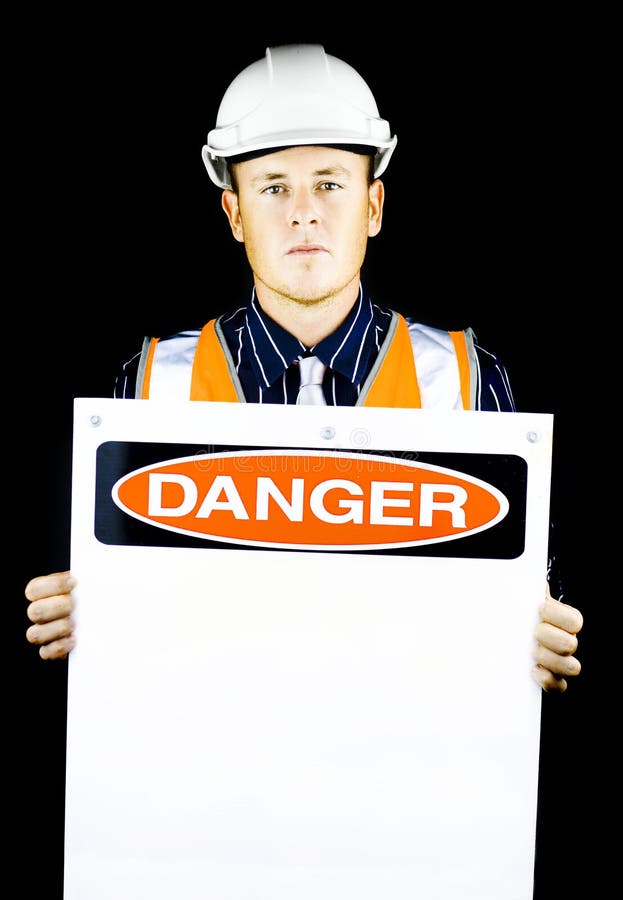 Man with Construction Helmet Holding Danger Sign Stock Photo - Image of ... Man with Construction Helmet Holding Danger Sign Stock Photo - Image of ...