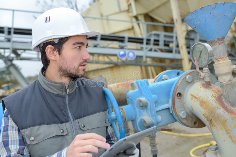 Man on Construction Site with Tablet Computer Stock Photo - Image of ...