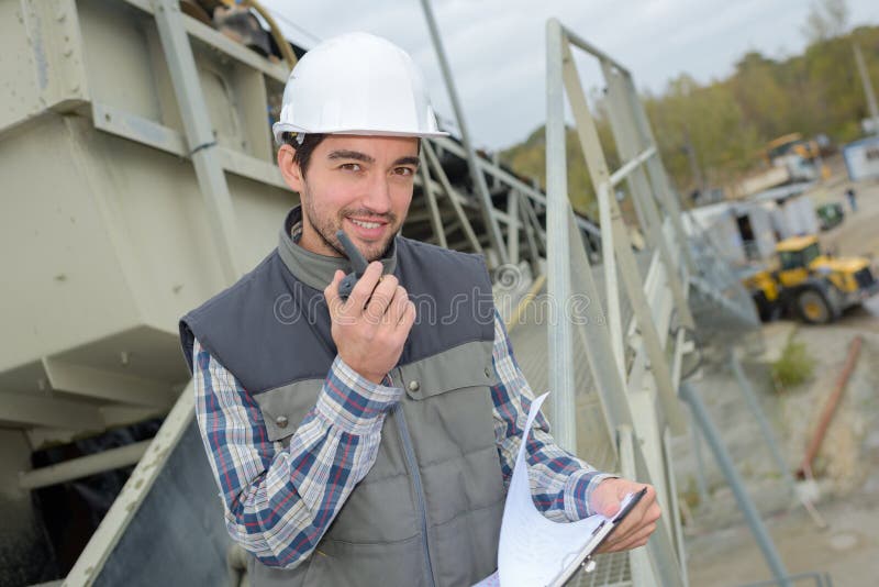 Man on Construction Site Using Walkie Talkie Stock Image - Image of ...