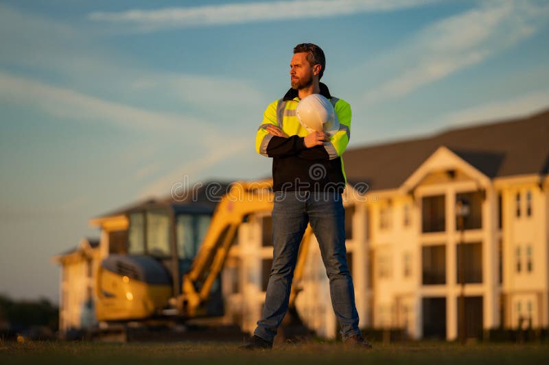 Man at Construction Site. Worker Constructor in Hardhat. Construction ...