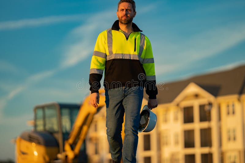 Man at Construction Site. Worker Constructor in Hardhat. Construction ...