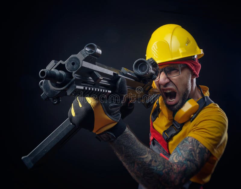 A Man in a Construction Worker`s Uniform Wearing a Hard Hat with an ...