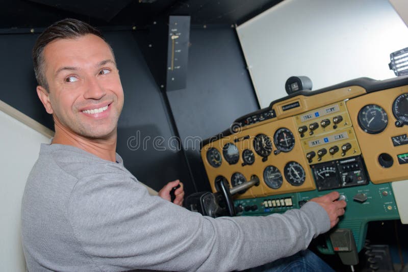 Man at Control Panel Turning and Smiling Stock Photo - Image of power ...