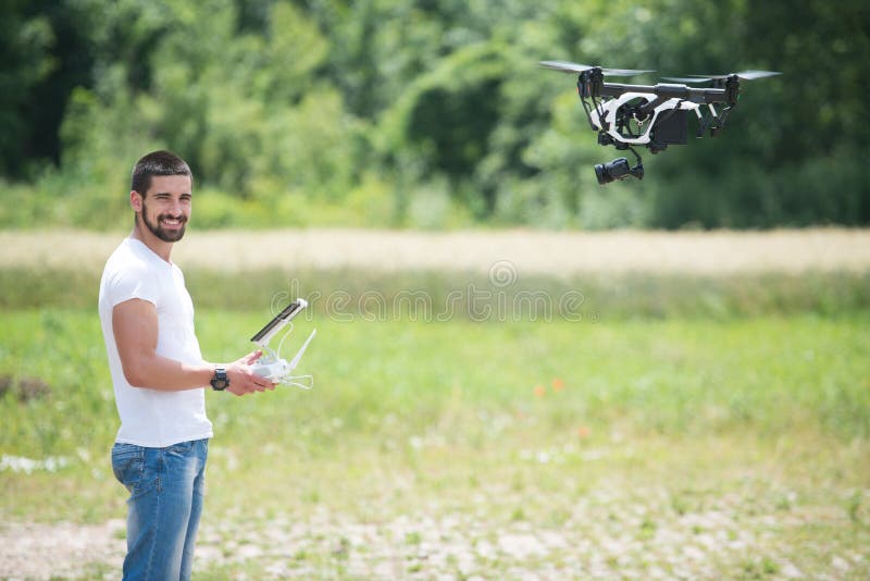 Man Controling a Drone stock image. Image of helicopter - 83778573