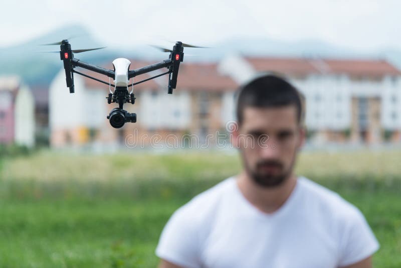 Man Controling a Drone stock photo. Image of professional - 83778884