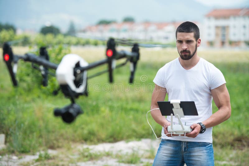 Man Controling a Drone stock image. Image of playing - 83779625