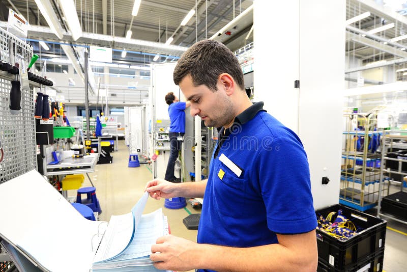 Man Controlled Assembly Instructions, in the Background Mounted a Woman ...