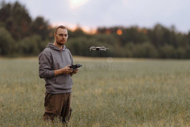 Man Controlling a Drone with a Remote Control Stock Image - Image of ...