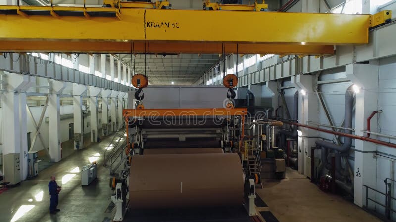 Man Controls Crane Putting Down Huge Paper Roll in Workshop Stock ...