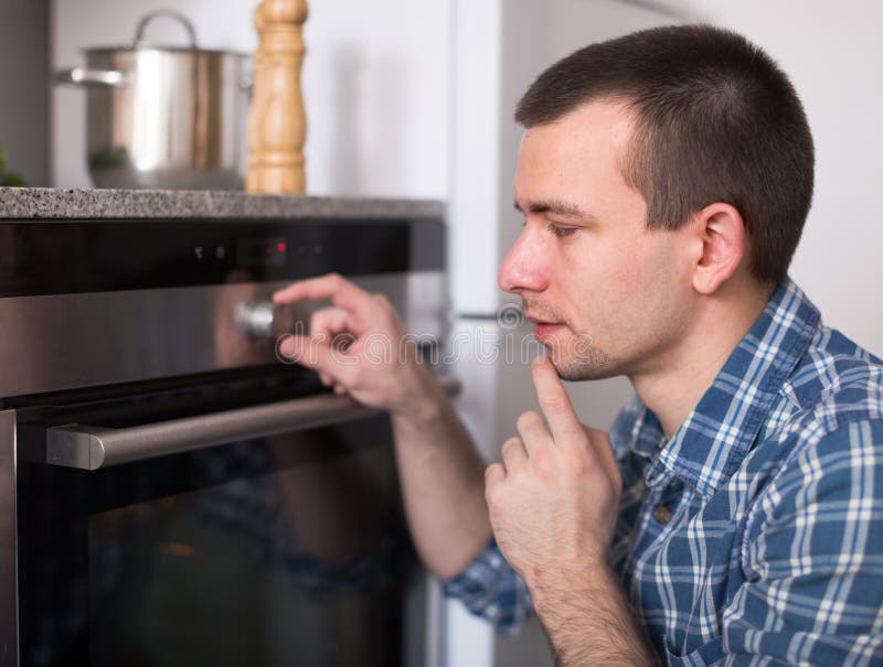 Man Controls Oven Kitchen Stock Photos - Free & Royalty-Free Stock ...