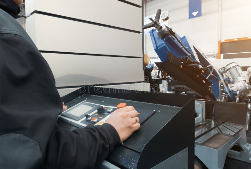 Man Controls the Remote Control of a Metal Cutting Machine Stock Image ...