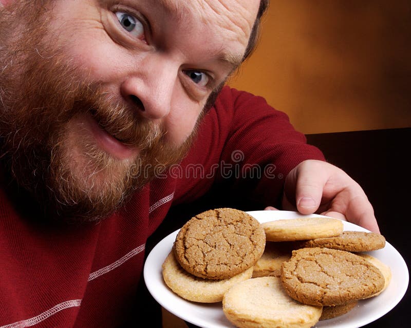 Man with Cookie stock photo. Image of hungry, male, shirt - 16224178