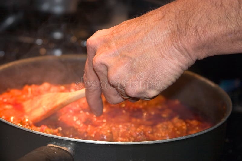 Man Cooking stock photo. Image of sauce, stove, kitchen - 599730