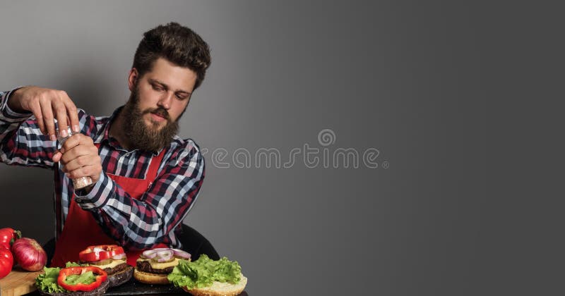 Man cooking burgers stock photo. Image of large, barbecue - 117082982