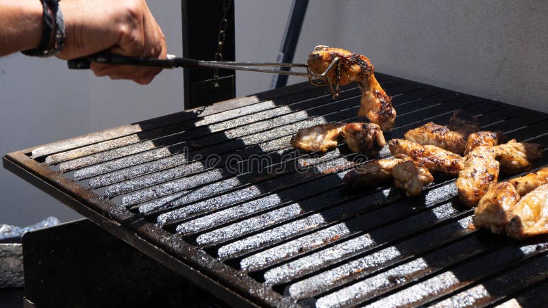 Man Cooking Chicken Wings on a Barbecue Stock Photo - Image of outdoors ...