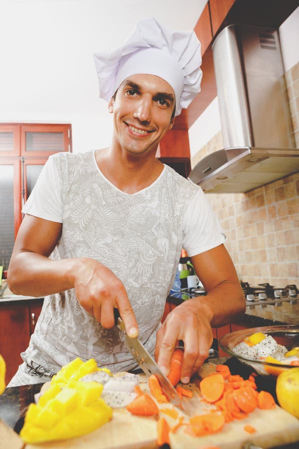 Man cooking dinner stock image. Image of carefree, modern - 55371053