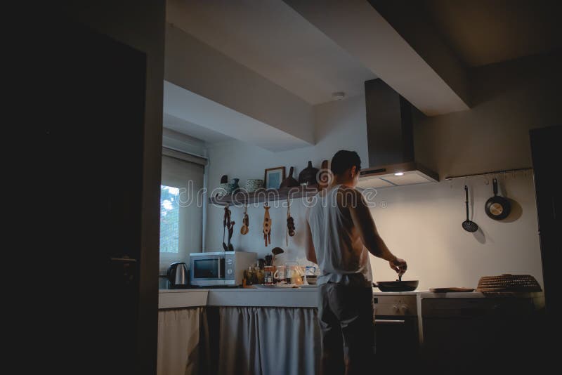 Man is Cooking Dinner in the Kitchen. Stock Image - Image of manly ...