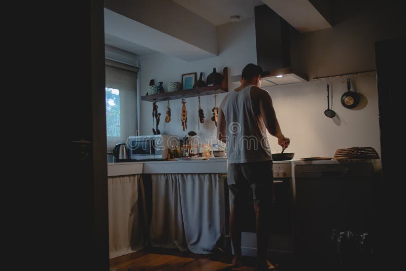 Man is Cooking Dinner in the Kitchen. Stock Image - Image of playful ...