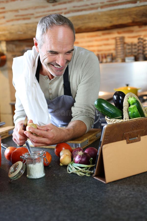 Man Cooking Easily with Help of Internet Stock Photo - Image of smiling ...