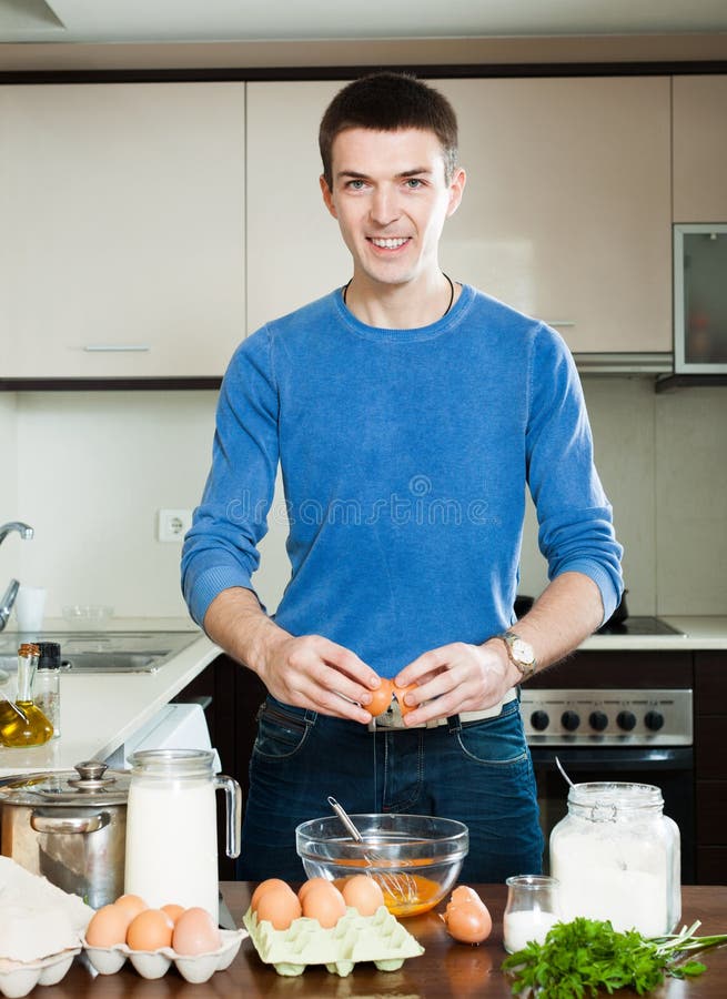 Man cooking eggs stock photo. Image of food, flour, kitchen - 42220036