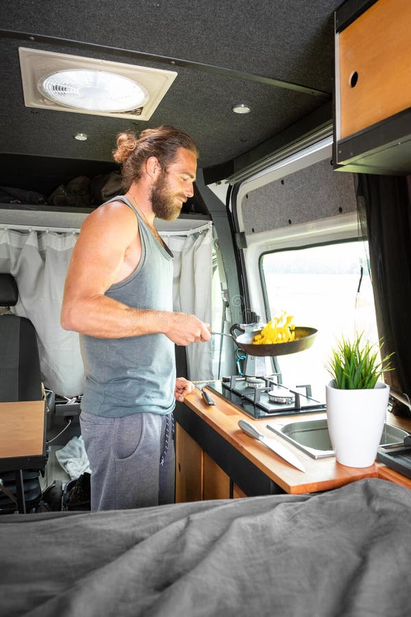 Man Cooking Food Inside His Camper Van Stock Photo - Image of life ...