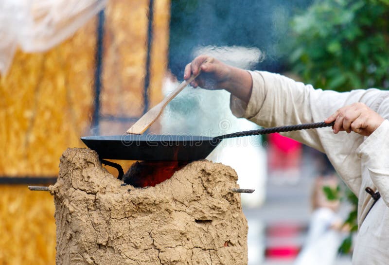 Man is Cooking Food in a Pan Over a Fire Stock Image - Image of meal ...