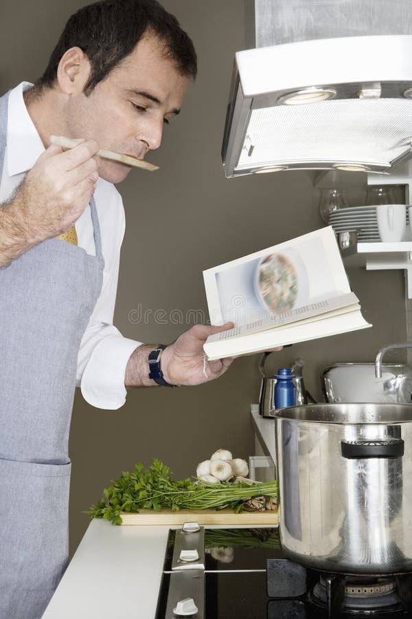 Man Cooking at Home stock image. Image of business, busy - 28832175