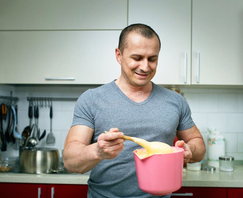 Man cooking at home stock photo. Image of home, hands - 68387638