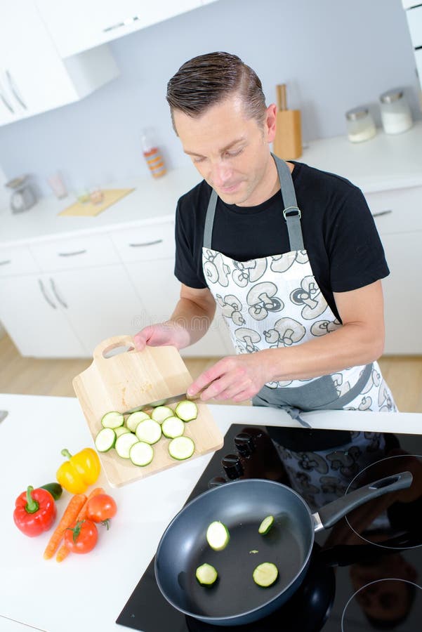 Man Cooking at Home in Kitchen Stock Image - Image of focus, lifestyle ...