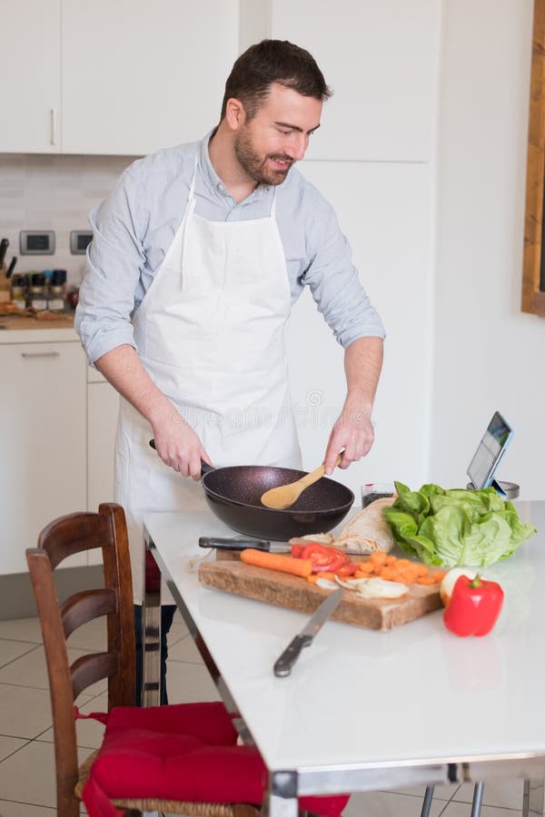 Man Cooking at Home and Preparing Food Stock Photo - Image of clothes ...