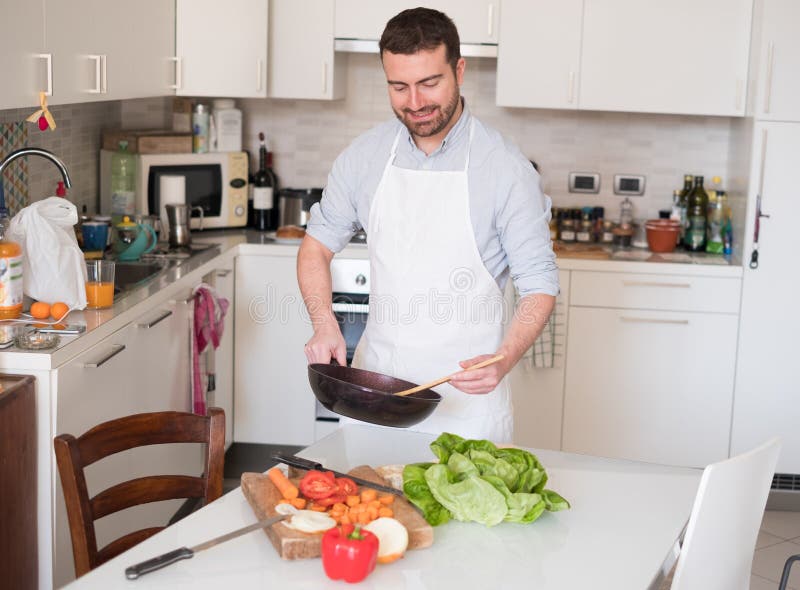 Man Cooking at Home and Preparing Food Stock Photo - Image of clothes ...