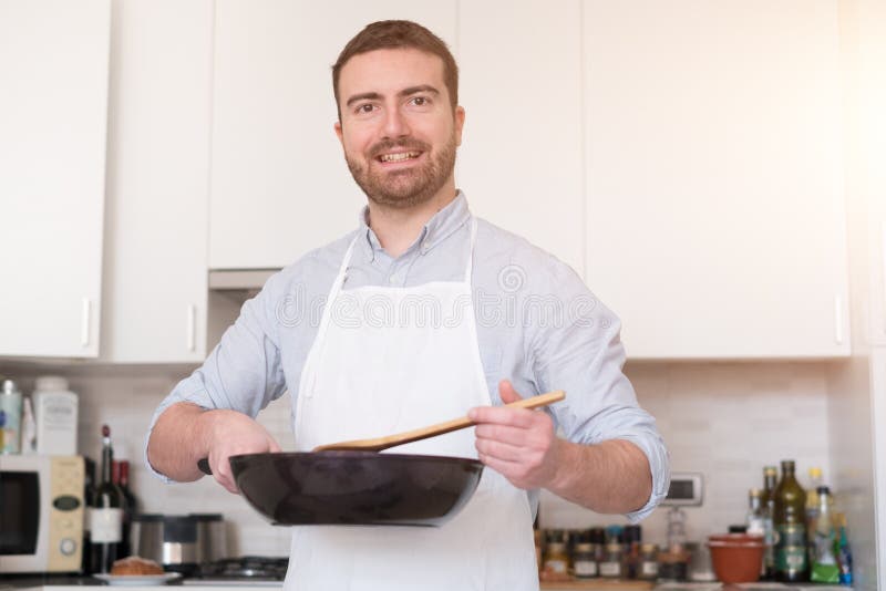 Man Cooking at Home and Preparing Food Stock Image - Image of ...