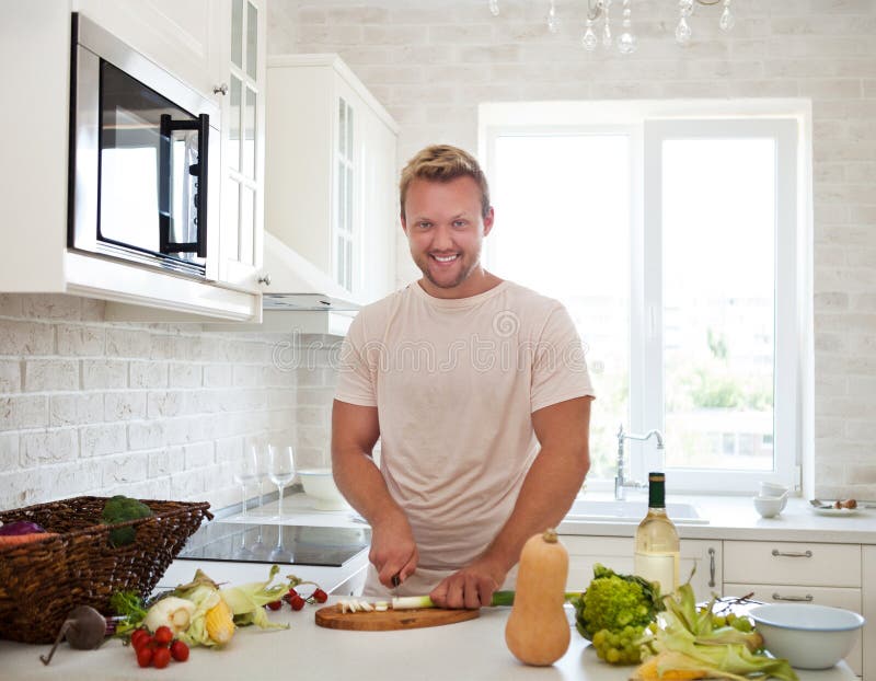 Man Cooking at Home Preparing Salad in Kitchen Stock Image - Image of ...