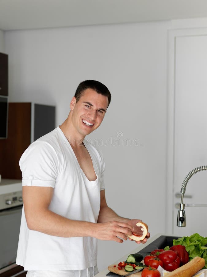 Man Cooking at Home Preparing Salad in Kitchen Stock Photo - Image of ...