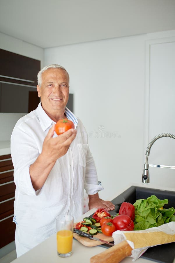 Man Cooking at Home Preparing Salad in Kitchen Stock Image - Image of ...
