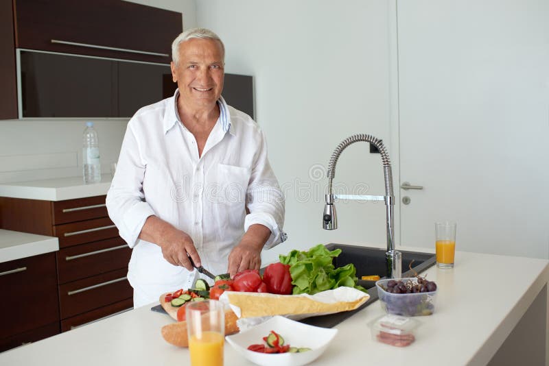 Man Cooking at Home Preparing Salad in Kitchen Stock Photo - Image of ...