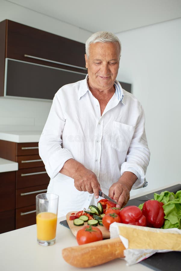 Man Cooking at Home Preparing Salad in Kitchen Stock Photo - Image of ...
