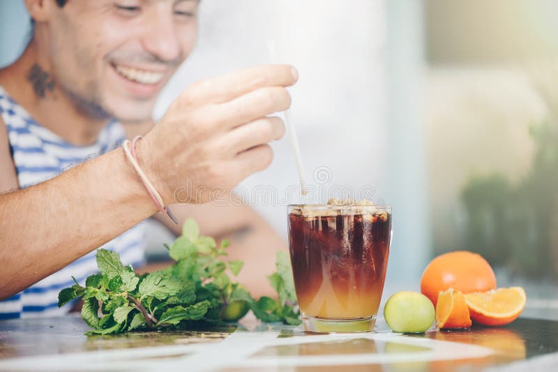Man is Cooking Ice Tea with Orange and Chrysanthemum at Bar Stock Photo ...