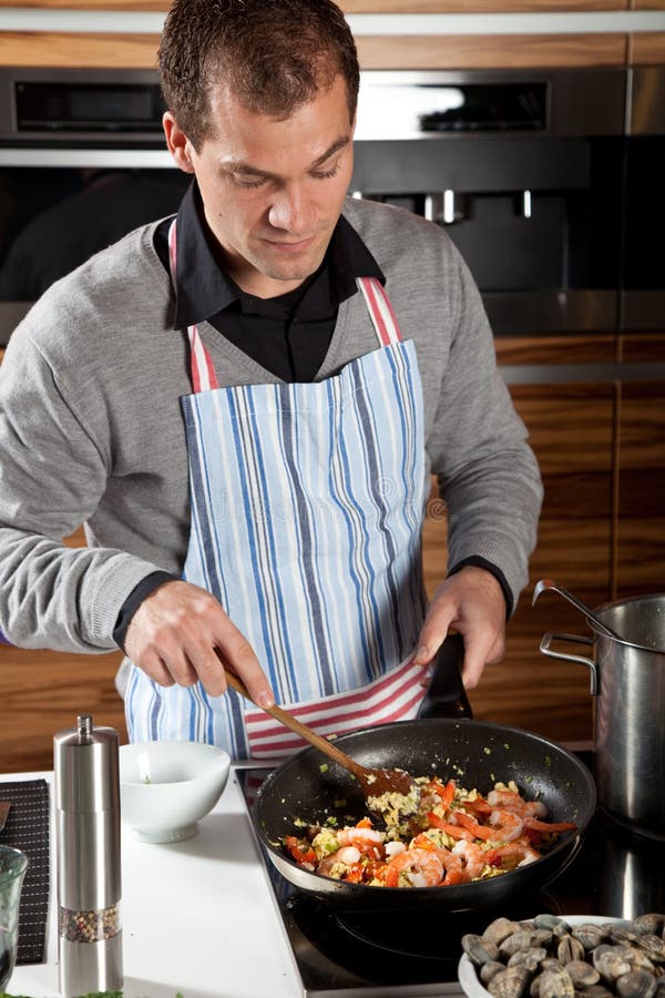 Man cooking in the kitchen stock image. Image of mature - 12479353