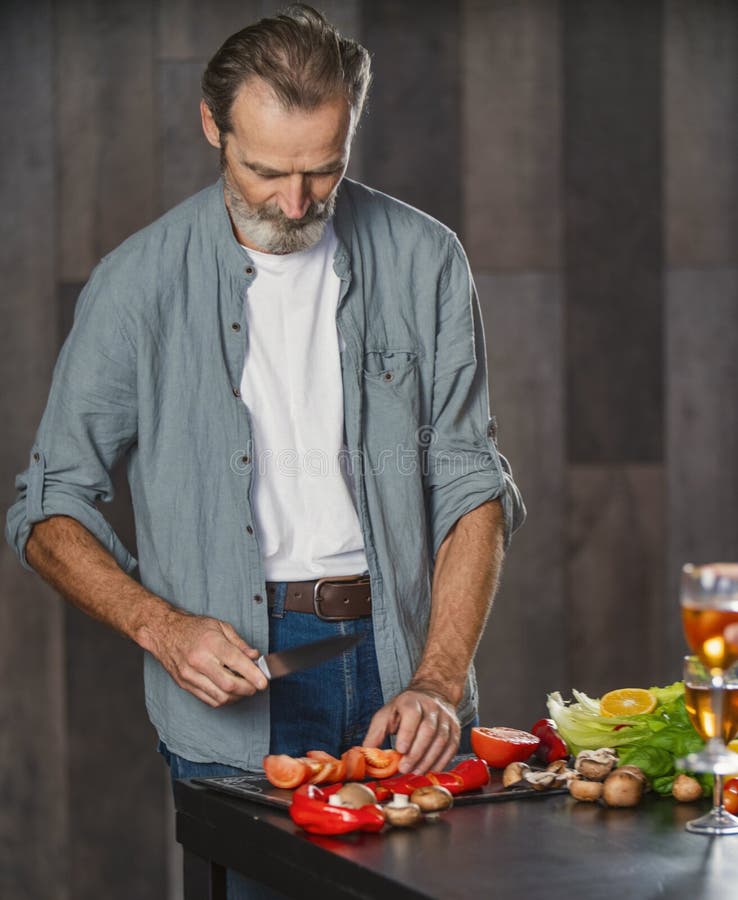Man cooking in the kitchen stock photo. Image of adult - 202313016