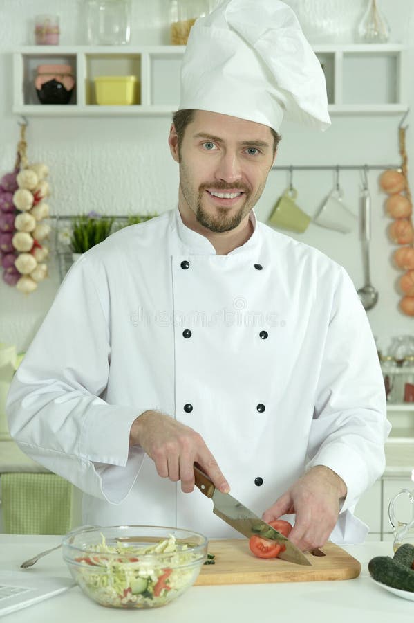 Man cooking in kitchen stock photo. Image of occupation - 72442874