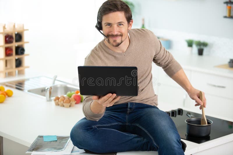 Man Cooking in Kitchen while Working Stock Photo - Image of cutting ...