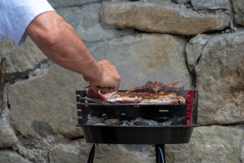 Man Cooking Meat on the Barbecue Stock Image - Image of hand, closeup ...