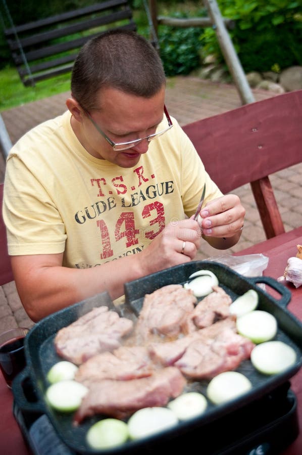 Man cooking outdoors stock photo. Image of cooking, barbecuing - 21167542