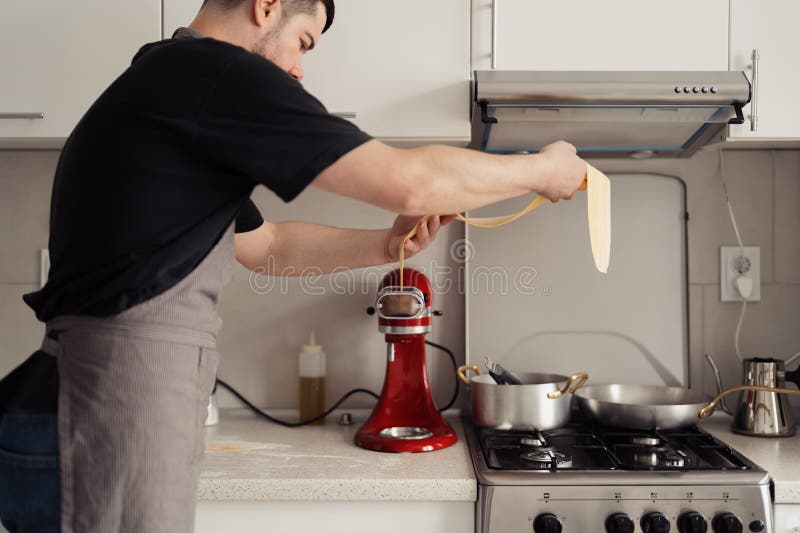Man Cooking Pasta in Modern Kitchen Setting Stock Image - Image of ...