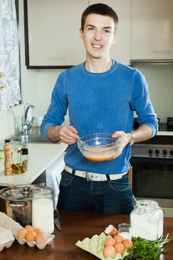 Man cooking scrambled eggs stock image. Image of caucasian - 38039969
