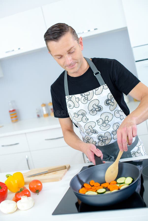 Man Cooking Vegetables at Home Stock Image - Image of profession ...
